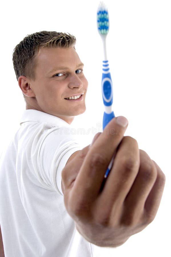Man showing his toothbrush stock image. Image of teeth - 6985607