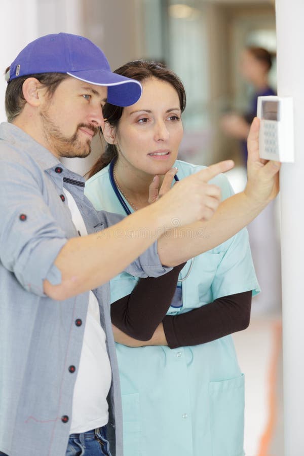 Man Showing How Air Conditioner Works Stock Photo - Image of woman ...