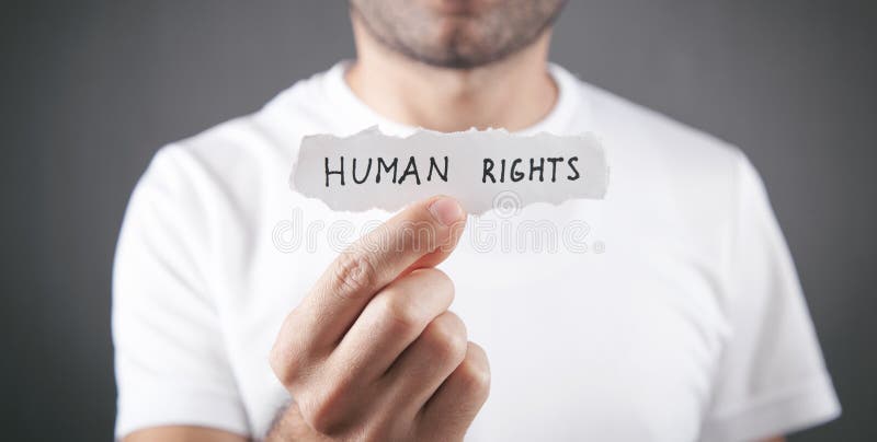 Man Showing Human Rights Text on Torn Paper Stock Photo - Image of ...