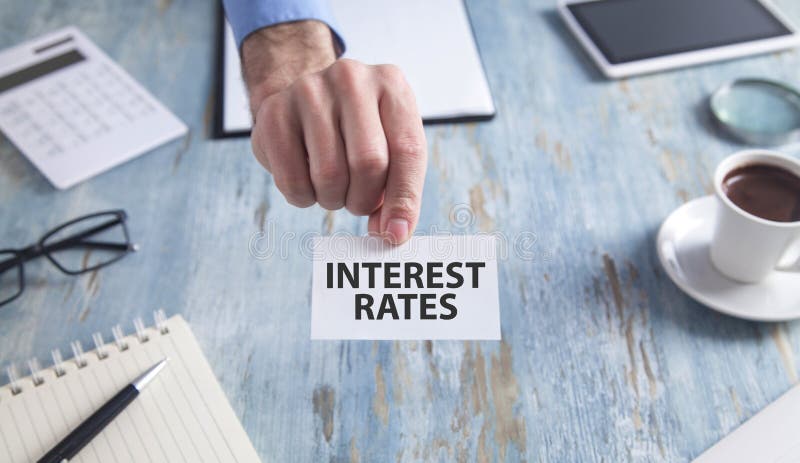 Man Showing Interest Rates Text on Business Card Stock Photo - Image of ...