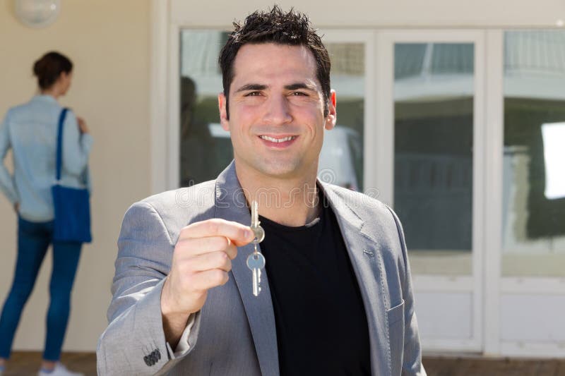 Man showing key house stock image. Image of moving, offering - 283149169