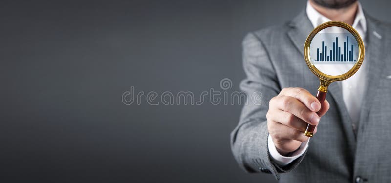 Man Showing Magnifying Glass with Graph. Business Analyzing Concept ...