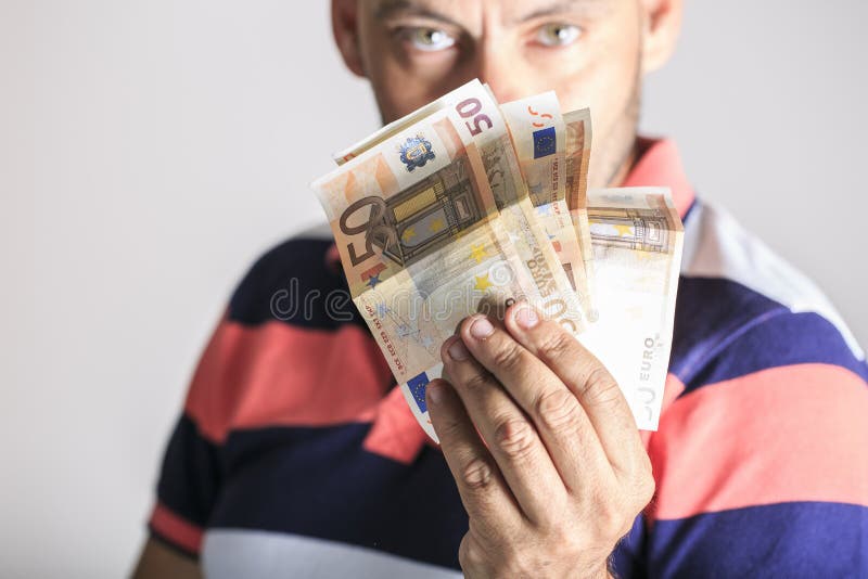 Man showing the money stock image. Image of handsome - 95692487