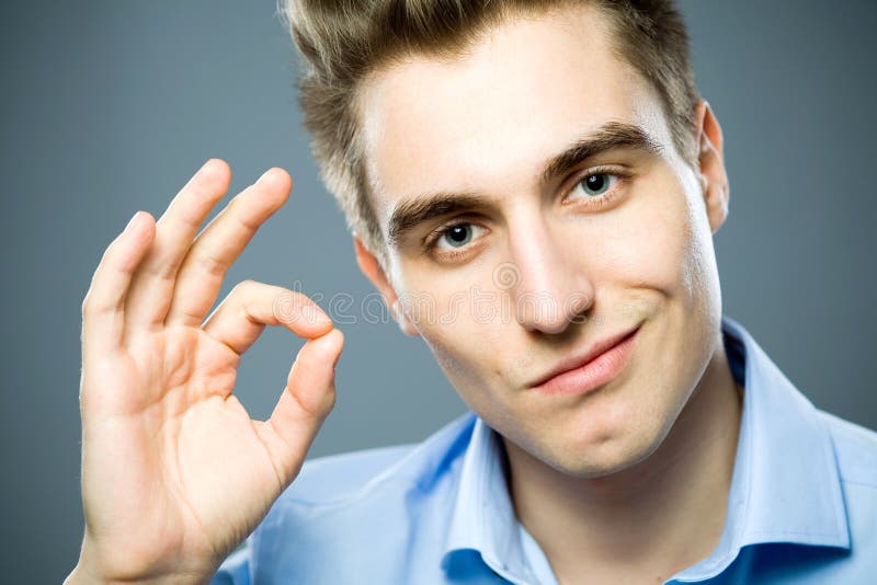 Man showing OK sign stock photo. Image of adult, studio - 23763078