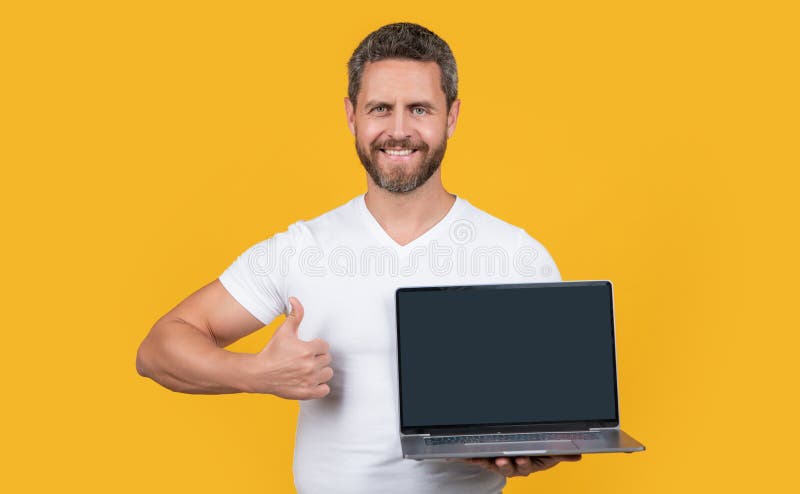 Man Showing Screen in Studio, Thumb Up. Man Showing Screen of Laptop ...