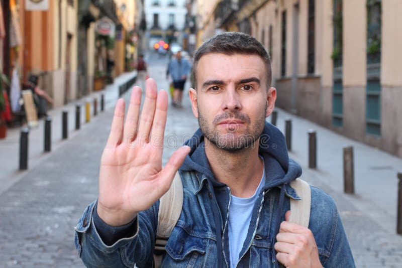 Man Showing a STOP Hand Sign Stock Photo - Image of industrial, command ...