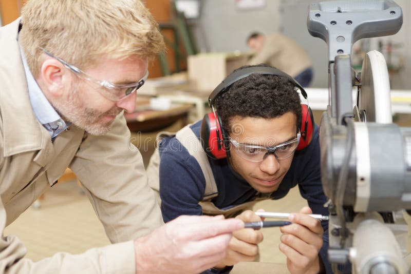 Man Showing Working Machinery To Apprentice Stock Photo - Image of ...