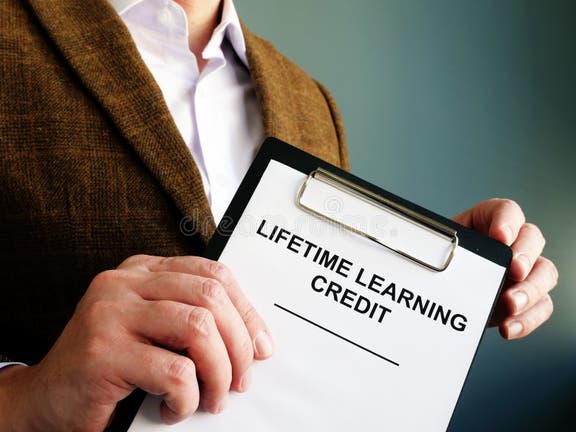 Man Shows Papers about Lifetime Learning Credit Stock Photo - Image of ...