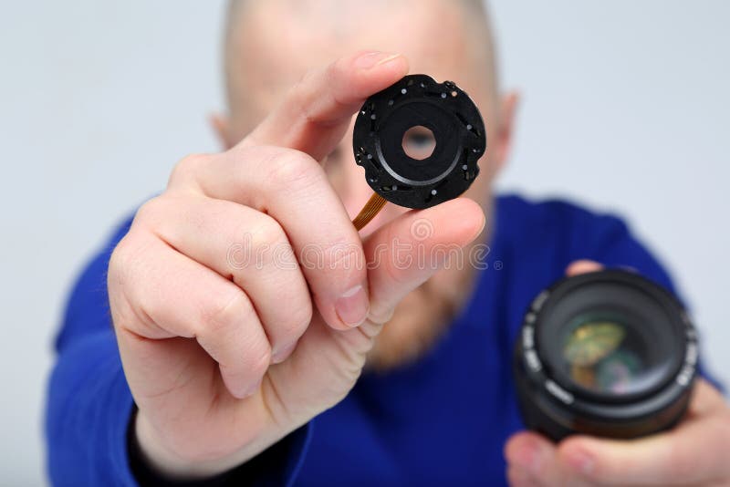 Man Shows Part of the Diaphragm of the Camera Lens Stock Photo - Image ...