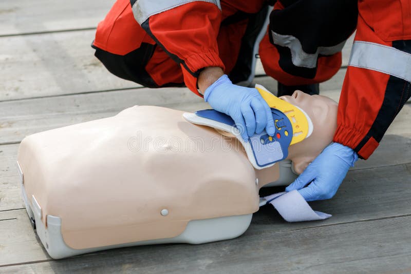 Rescue Team. the Man Shows the Provision of First Aid in the ...