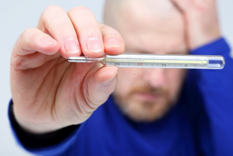 Man Shows a Thermometer with a High Temperature Stock Image - Image of ...
