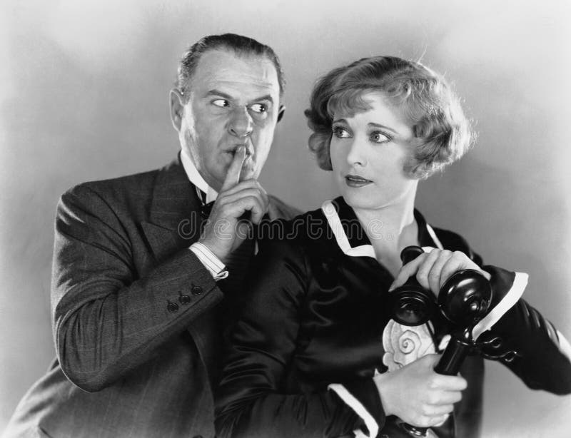 Man Shushing Woman on Telephone Stock Image - Image of advise ...