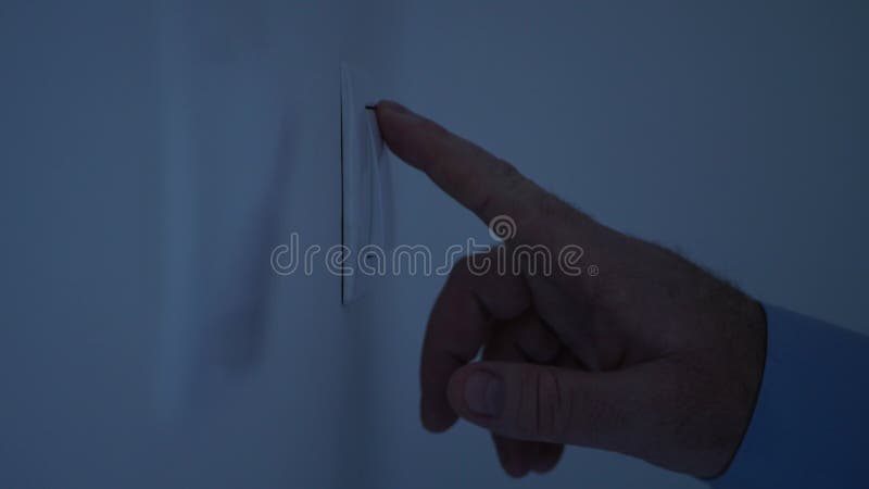 Man Shutting Off the Light in the Office from the Switch on the Wall ...
