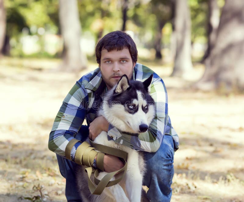 Man and the Siberian Husk stock image. Image of purebred - 60104307