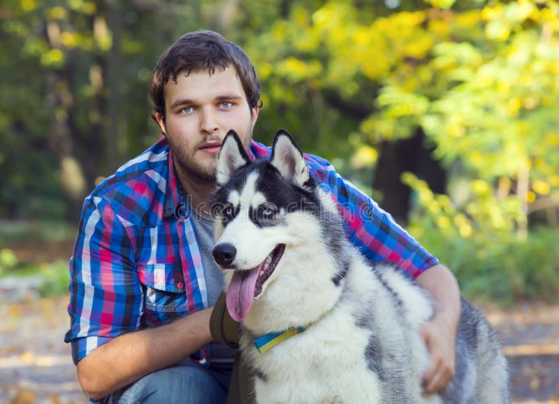 Man and the Siberian Husk stock image. Image of portrait - 60104809