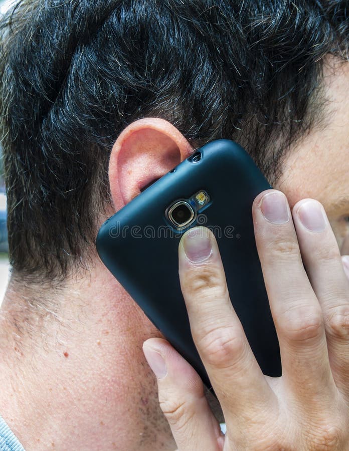 Man Side Holding His Cell Phone Ear Stock Photos - Free & Royalty-Free ...