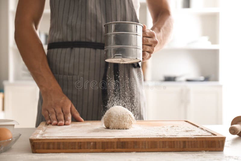 Man Sifting Flour Over Dough in Kitchen Stock Photo - Image of people ...