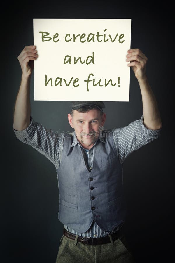 Man with Sign Be Creative and Have Fun Stock Photo - Image of card ...