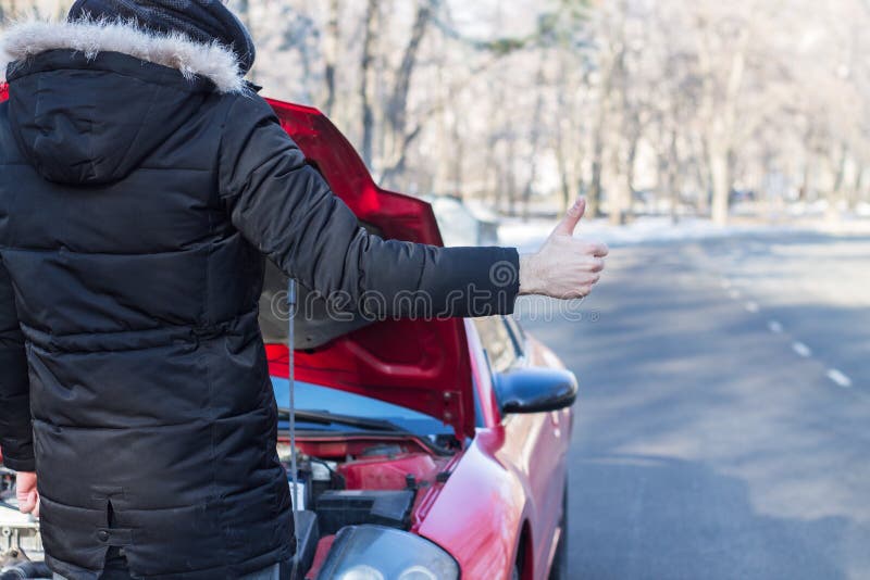 Man Signaling Problems with Sport Car on Winter Road. Stock Image ...