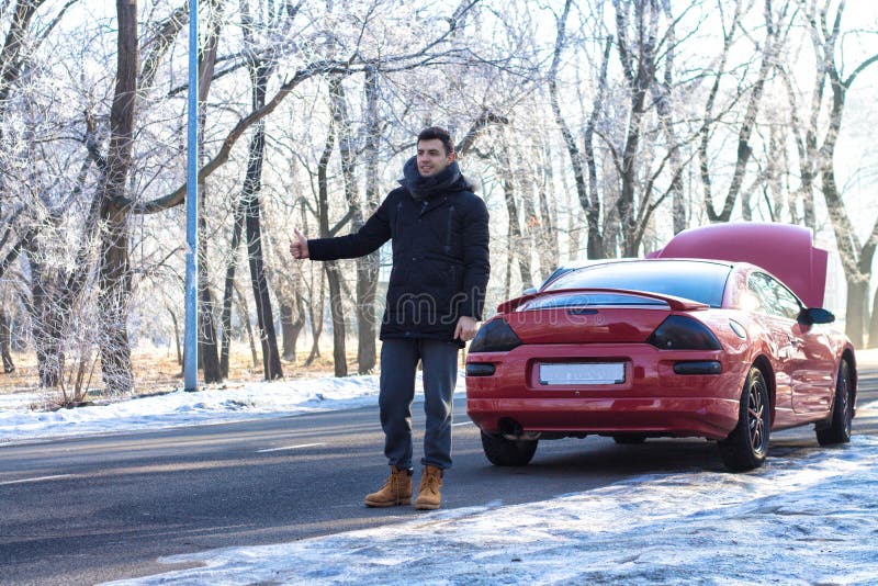 Man Signaling Problems with Sport Car on Winter Road. Stock Image ...