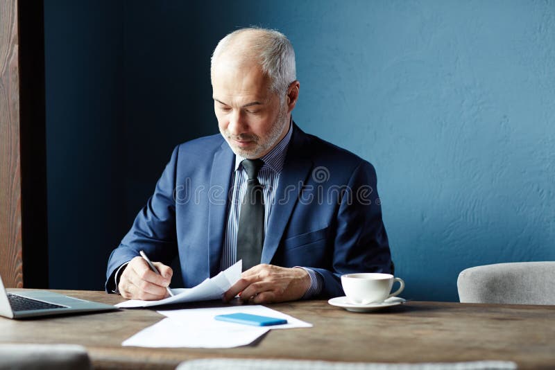 Man signing a contract stock image. Image of mature - 117731385