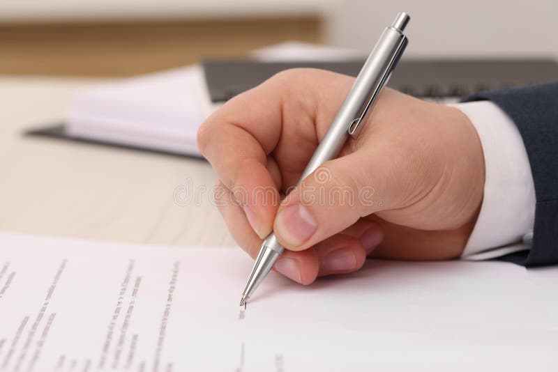 Man Signing Document at Table, Closeup View Stock Photo - Image of ...