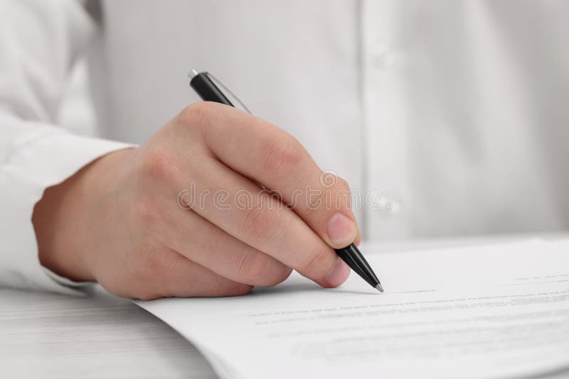 Man Signing Document at Wooden Table, Closeup Stock Image - Image of ...
