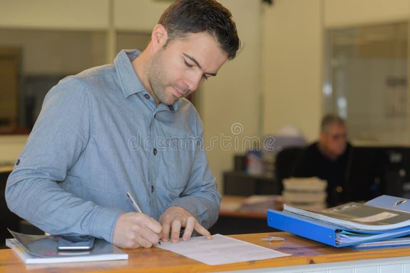 Man Signing Documents at Notary Office Stock Photo - Image of contract ...