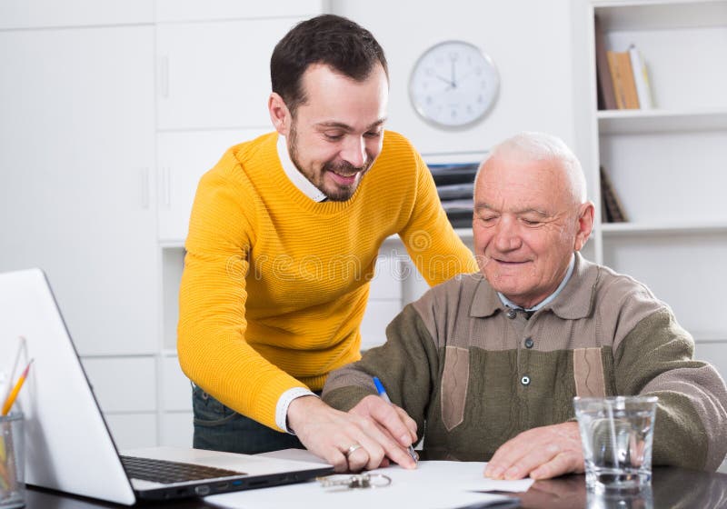 Man Signing Papers in Office Stock Photo - Image of determined, choice ...
