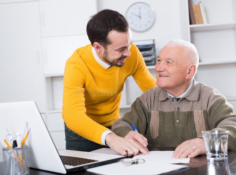Man Signing Papers in Office Stock Image - Image of conditions, indoors ...