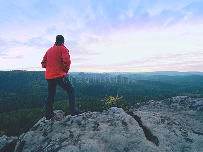 Man Silhouette on Cliff. Hiker in Red Jacket Climbed Up To Peak Enjoy ... Man Silhouette on Cliff. Hiker in Red Jacket Climbed Up To Peak Enjoy ...