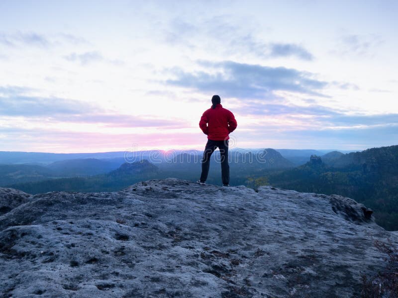 Man Silhouette on Cliff. Hiker in Red Jacket Climbed Up To Peak Enjoy ... Man Silhouette on Cliff. Hiker in Red Jacket Climbed Up To Peak Enjoy ...