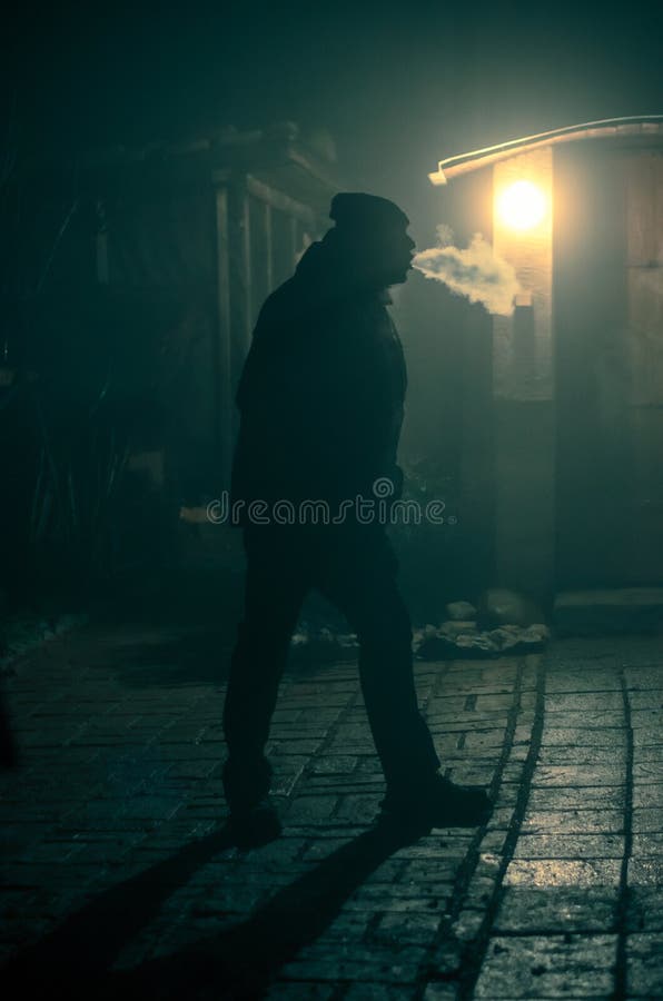 Smoking alone at night stock image. Image of mist, ecology - 149561237
