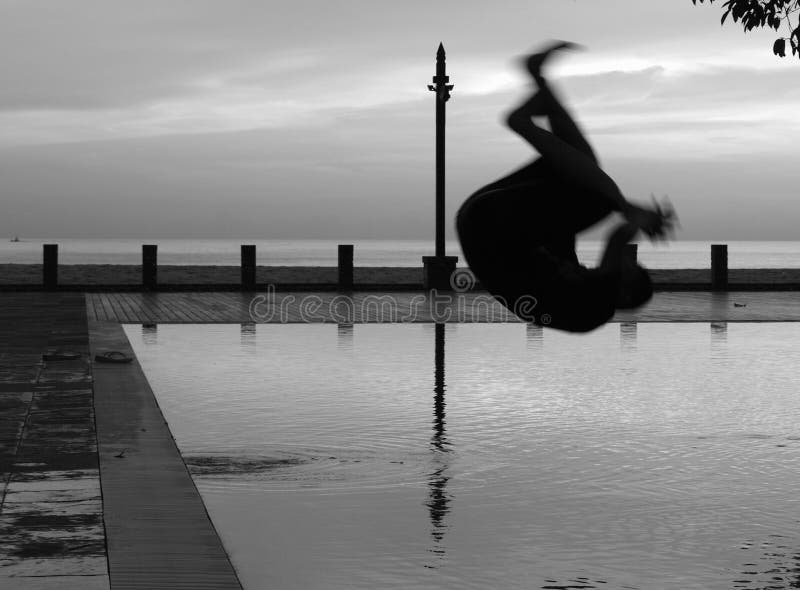 Man Silhouette Somersault Pool One Picture. Image: 6357076