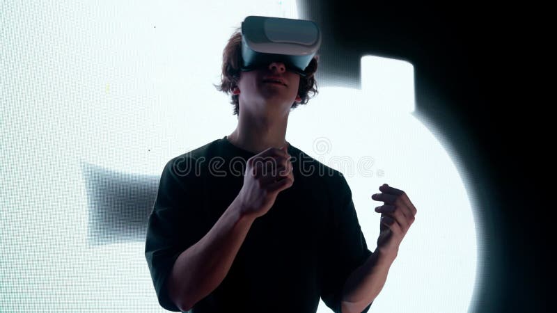 Man Silhouette in Virtual Reality Glasses Standing in Front of Digital ...