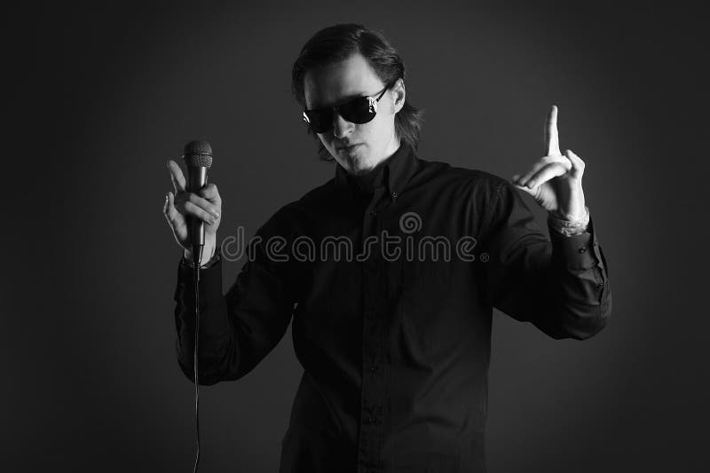 Man Singer with Microphone Hands Up, Fingers Point Stock Image - Image ...
