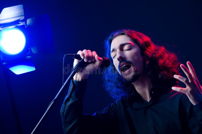 Man singing at the concert stock photo. Image of person - 22992672