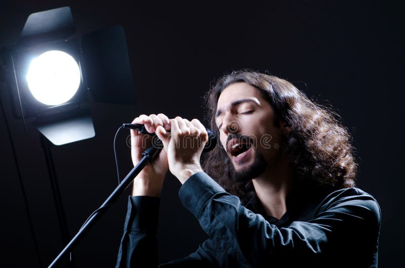 Man singing at the concert stock photo. Image of microphone - 23111586