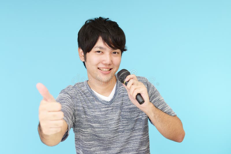 Man Singing Pose Holding Microphone Stock Photos - Free & Royalty-Free ...