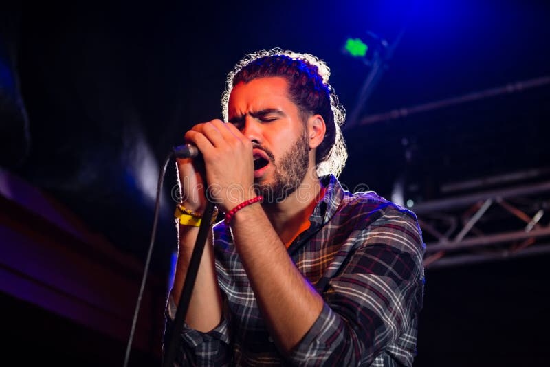 Man singing on microphone stock image. Image of lifestyle - 93235589