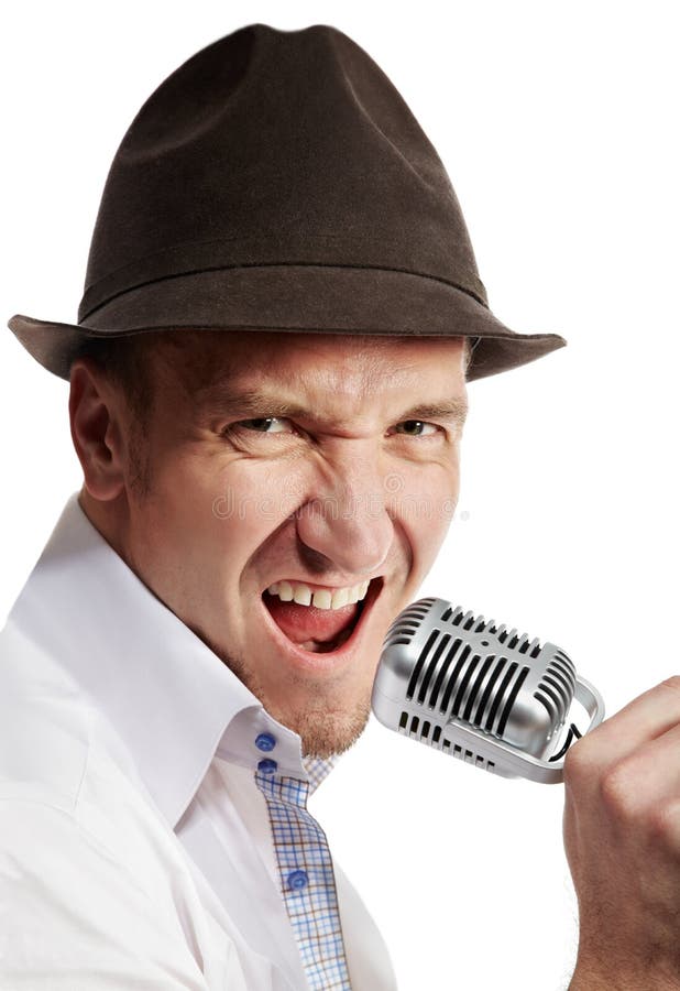 Side View of a Young Man Singing into Microphone Stock Photo - Image of ...