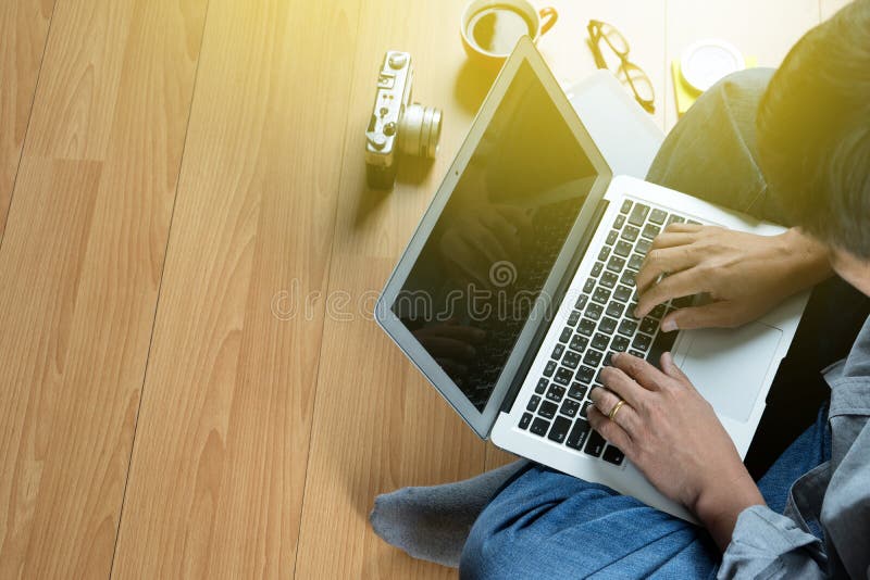 Man sit on floor computer stock image. Image of holding - 73648465