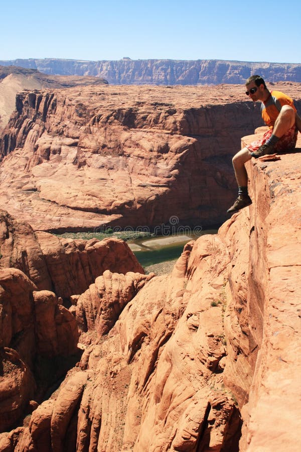 Man sits cliff edge stock image. Image of colorado, cliff - 5074741
