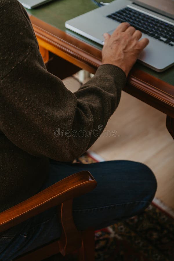 Man Sits in Front of Computer Stock Photo - Image of portable, jeans ...