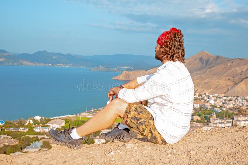 A Man Overlooking a Panoramic View of a Beautiful Coastline Stock Image ...