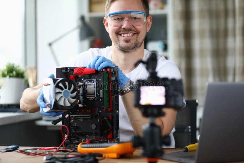Man Sits at Table and Repairs Computer Processor Stock Photo - Image of ...