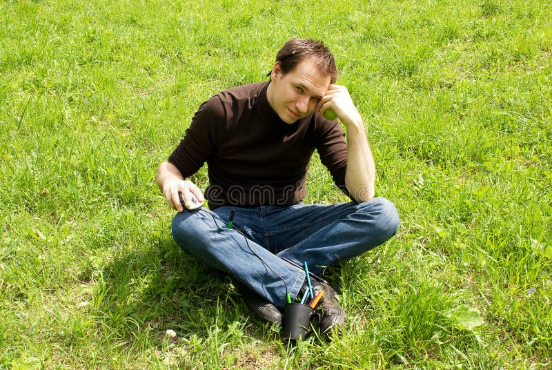 Man sitting stock photo. Image of green, grass, creativity - 10947400