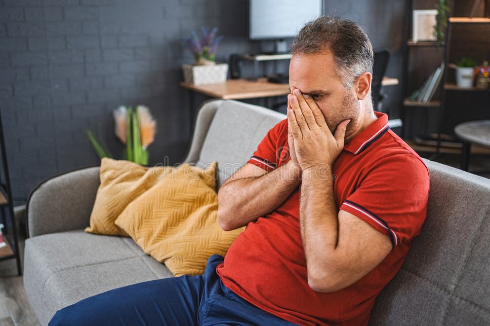 Man Sitting Alone at Home Looking Sad and Distraught Stock Image ...