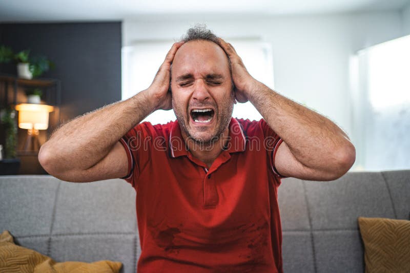 Man Sitting Alone at Home Looking Sad and Distraught Stock Image ...