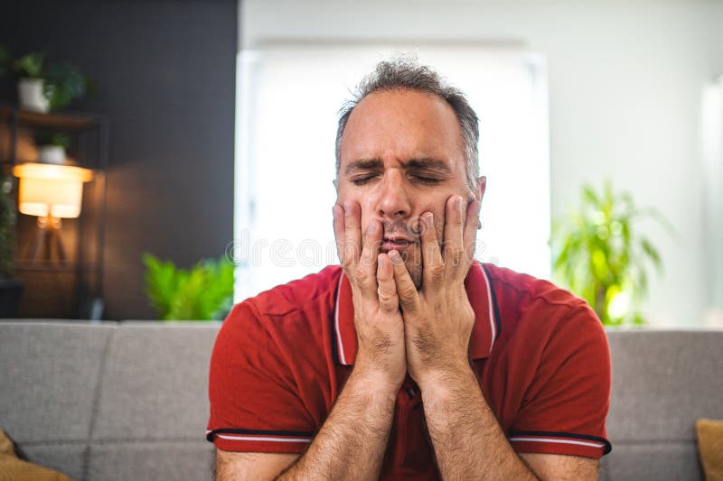 Man Sitting Alone at Home Looking Sad and Distraught Stock Photo ...